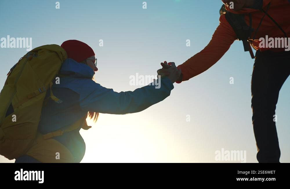 teamwork. help travel silhouette concept. group team of tourists lends ...