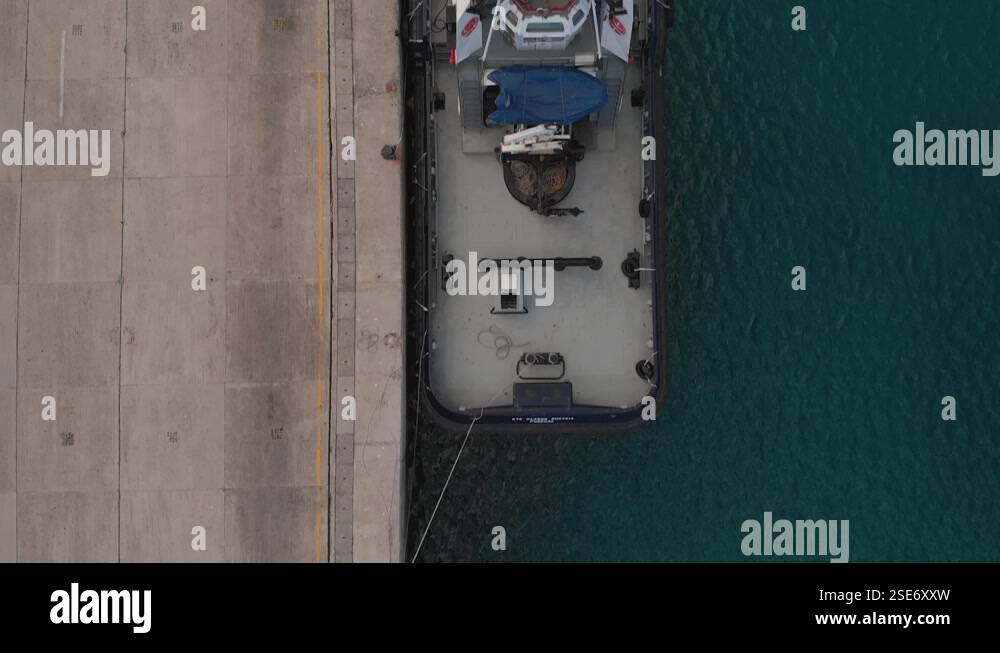 Boats moored at harbor. Aerial top-down forward Stock Video Footage - Alamy