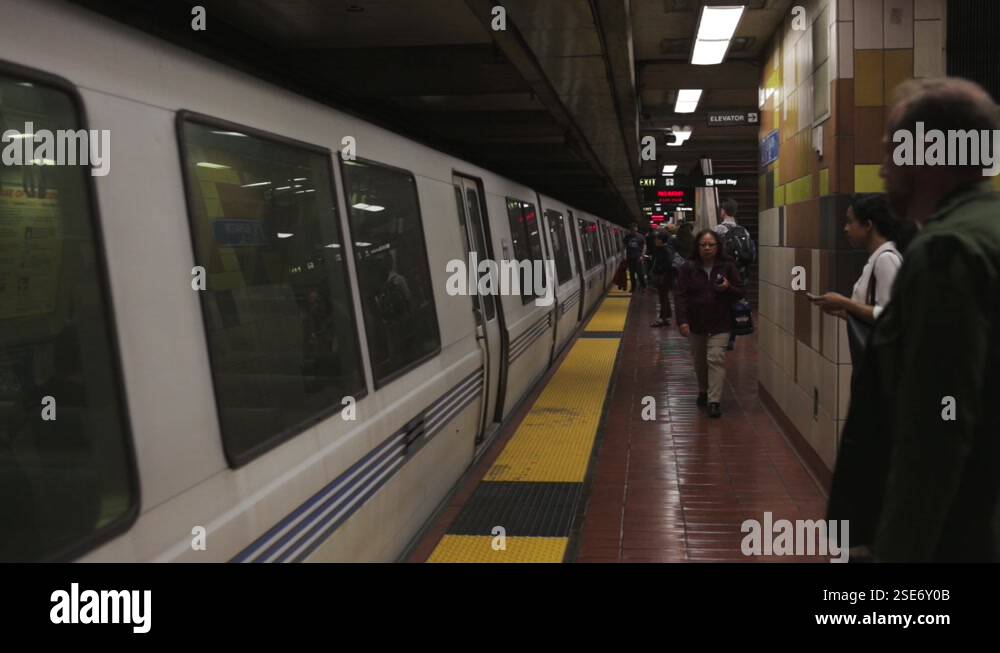 People Waiting to Board the Train at the Mission BART station in San ...