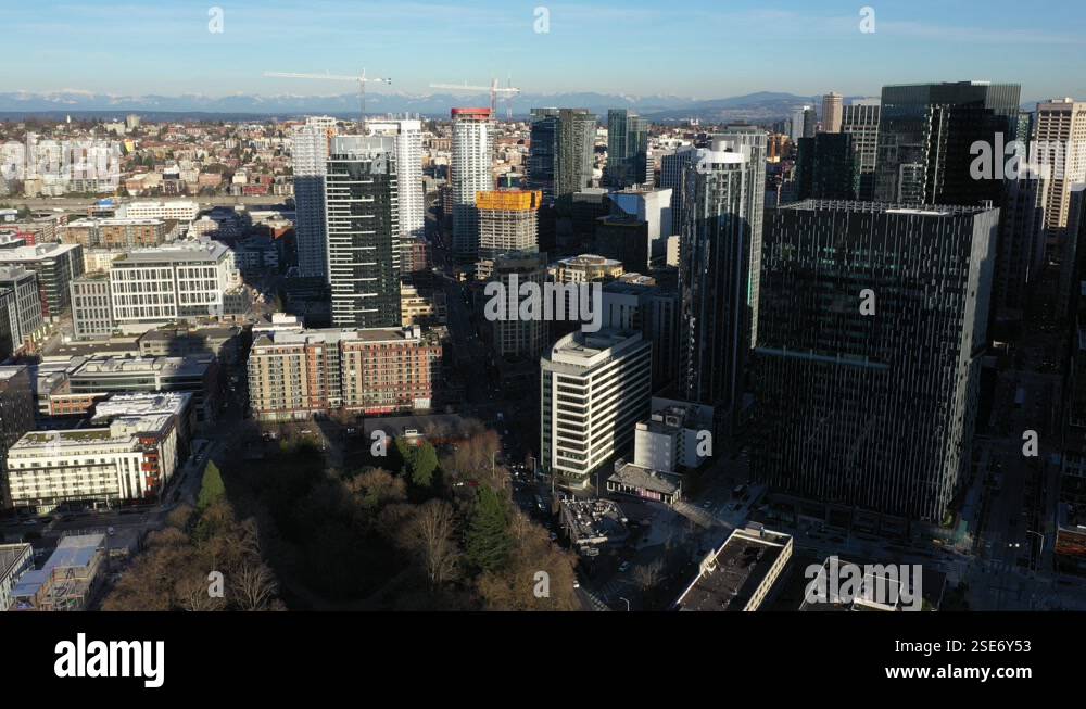 Cinematic aerial drone footage of downtown Seattle, Denny Park, Pike ...