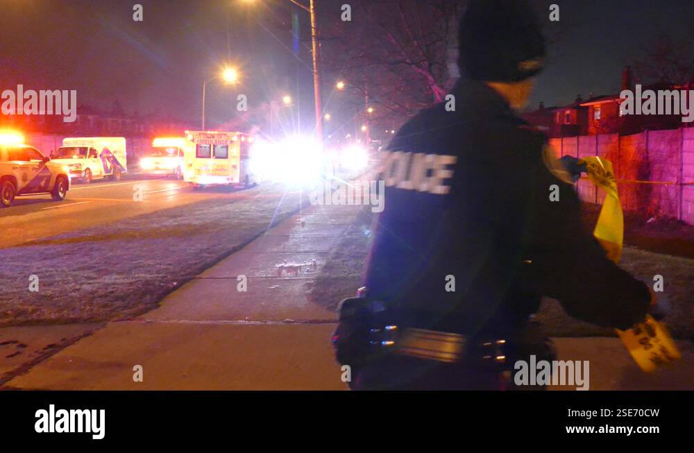Police place caution tape during incident at night, Canada, medium to ...