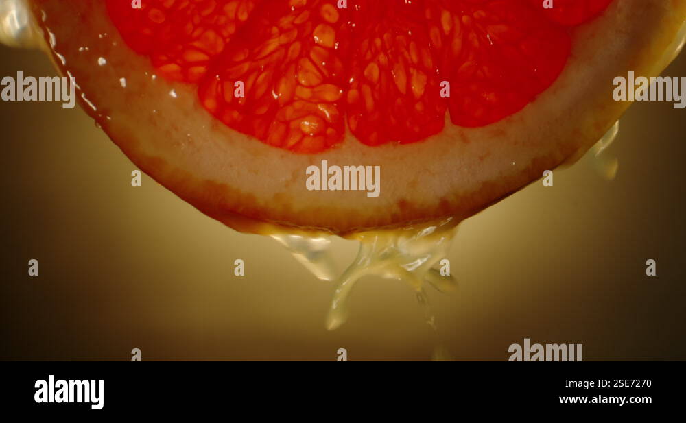 Water running down fresh pulp of grapefruit. Citrus fruit rich in ...