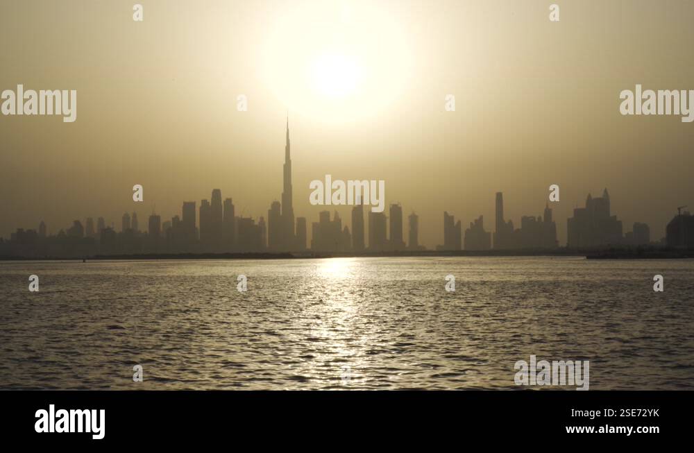 Bright Yellow Sunset Shining Over Dubai Skyline And Dubai Creek In UAE ...