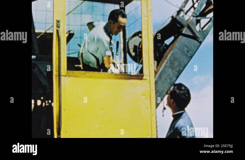 1950s: Priest shakes hand of worker in heavy machinery at sugar ...