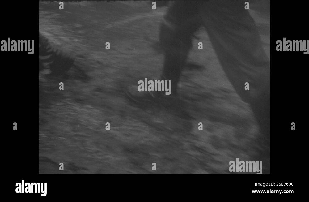 1940s: Soldiers walking in mud. Soldiers, jeep on road. Soldiers ...