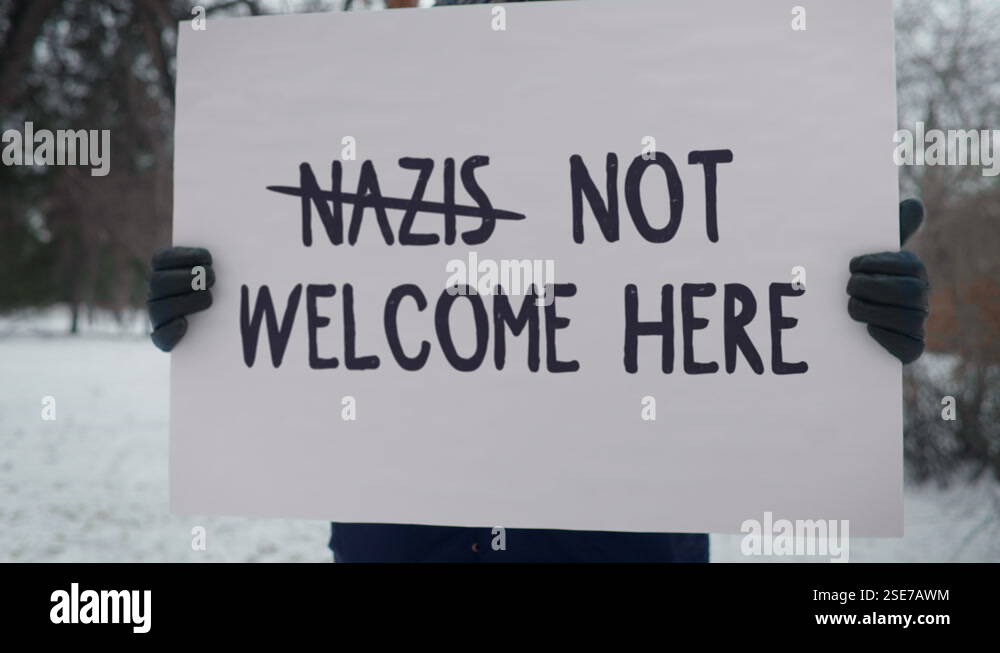 Man with a Sign that Says Nazis Not Welcome Here. Protest for Racial ...