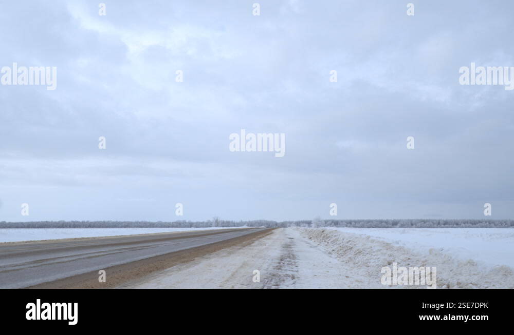 Clouds float over steppe asphalt road leading to the forest Stock Video ...