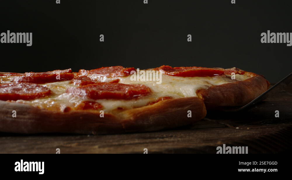 Close up shot of taking a piece of freshly baked pizza with tasty ...