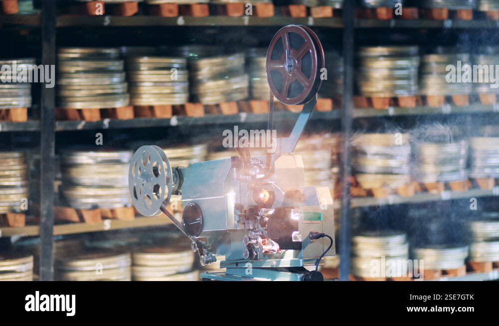Antique video projector is demonstrating a film in the archive Stock ...