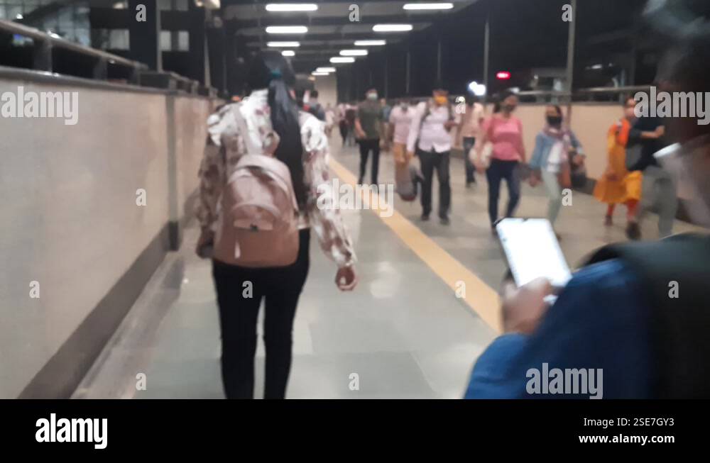 Daily Commuters walking inside metro station Stock Video Footage - Alamy
