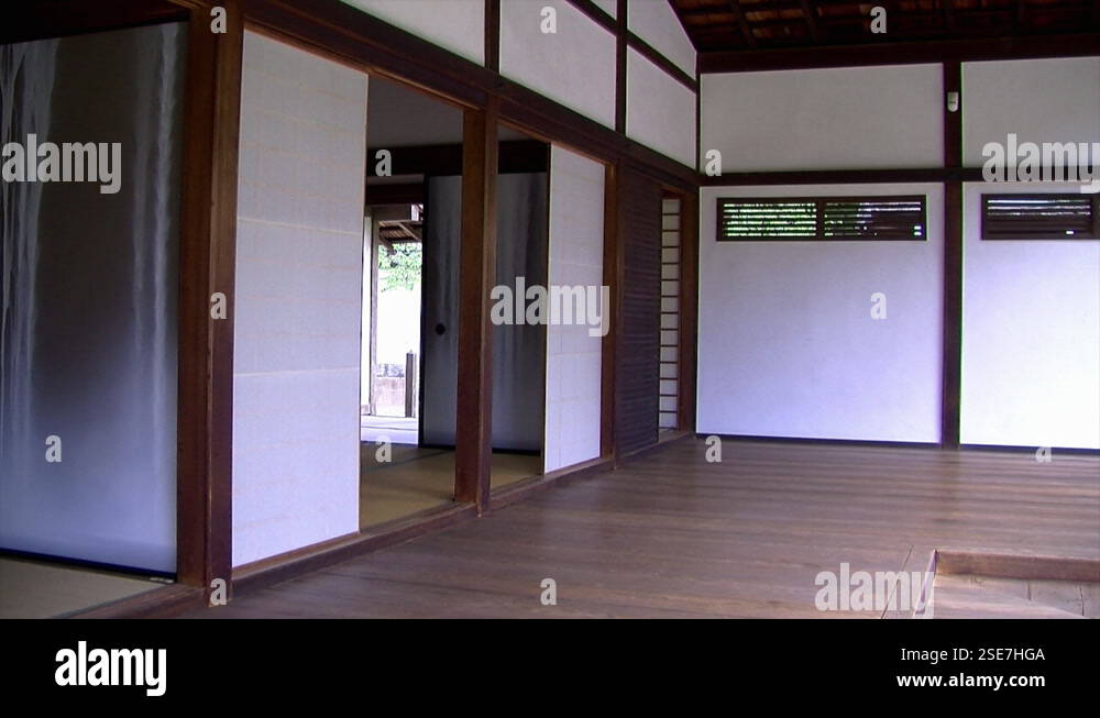 Pan from engawa (veranda) of Japanese house to interior with fusuma ...