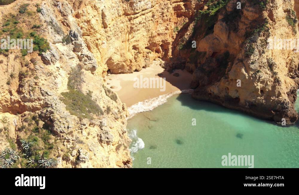 Paradisiac secluded beach surround by steep cliffs, Atlantic ocean ...