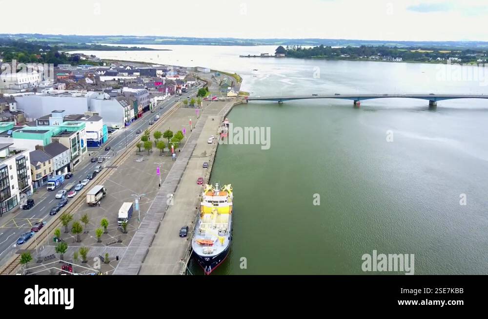 Passing over the downtown shore line waterfront with boats docked and ...