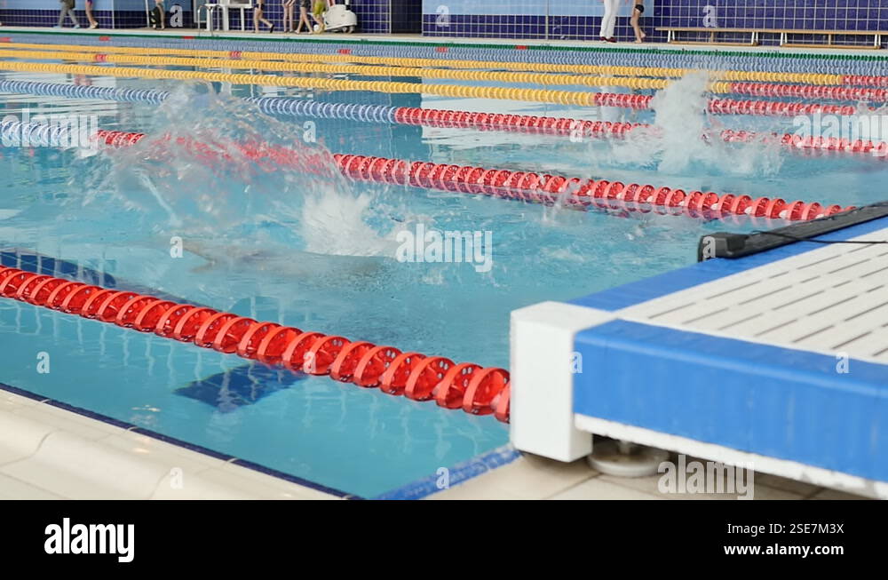 Start swimmers teenagers in the pool in the swimming competition. Preparing for Stock Video ...