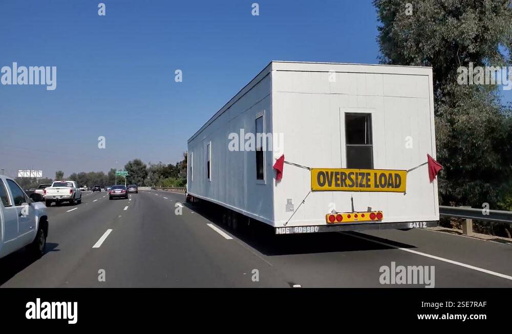 Oversized Load manufactured home on freeway being transported slow and ...