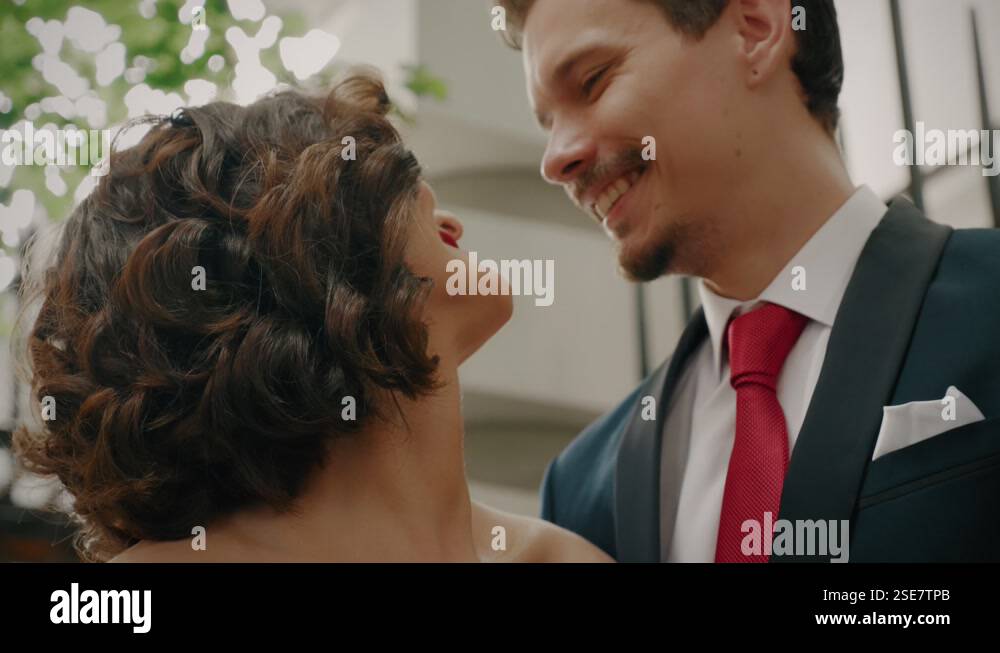 Beautiful enamored couple smiling looking to each other feeling love ...