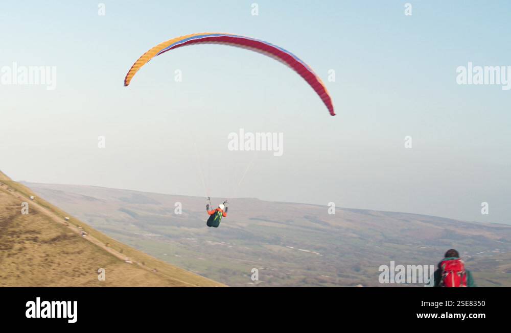 Paraglider Flying Close Over Hikers, Turning And Soaring On Thermals ...
