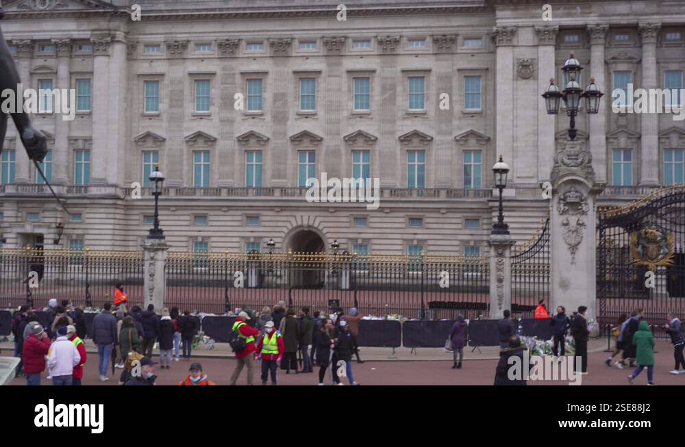 Buckingham Palace wide shot of Union Jack flying at half-mast and ...