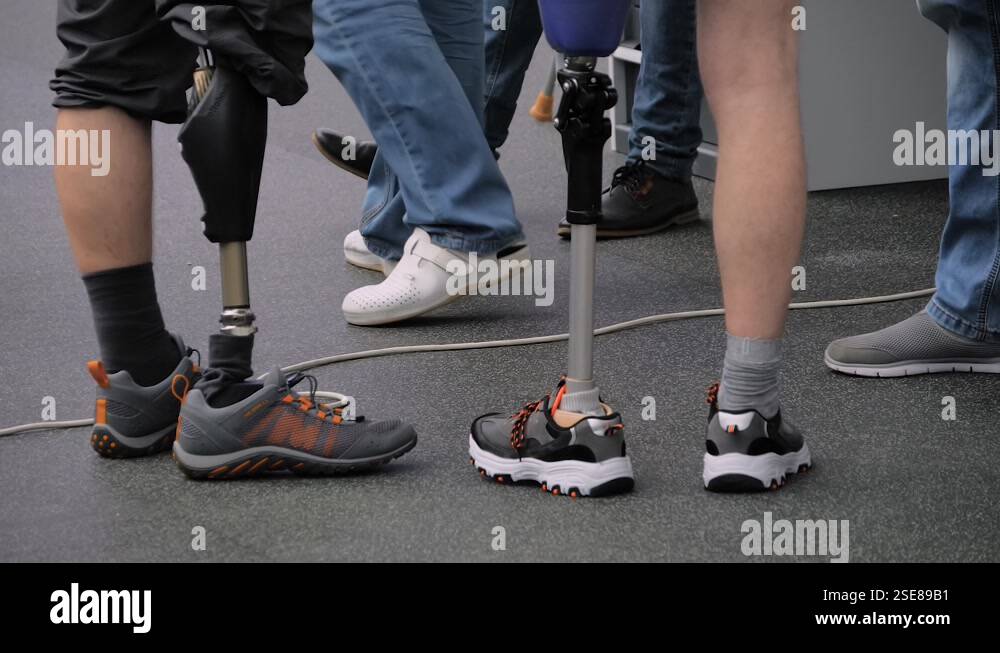 Group of people standing at competition for disabled persons with leg ...