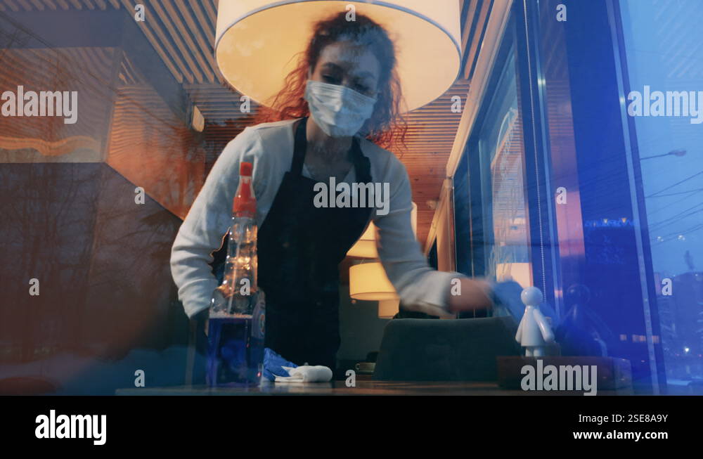A waitress and a waiter are wiping tables in a cafe Stock Video Footage ...