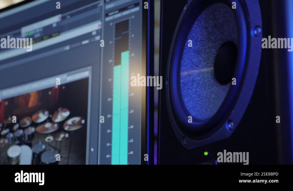 Vibrating working loudspeaker woofer on studio sound monitor. Moving ...