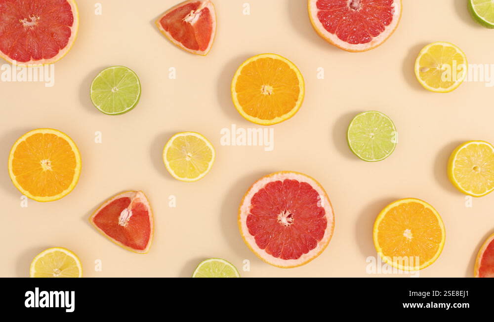 Creative sliced fresh organic citrus fruits pattern move. Stop motion ...
