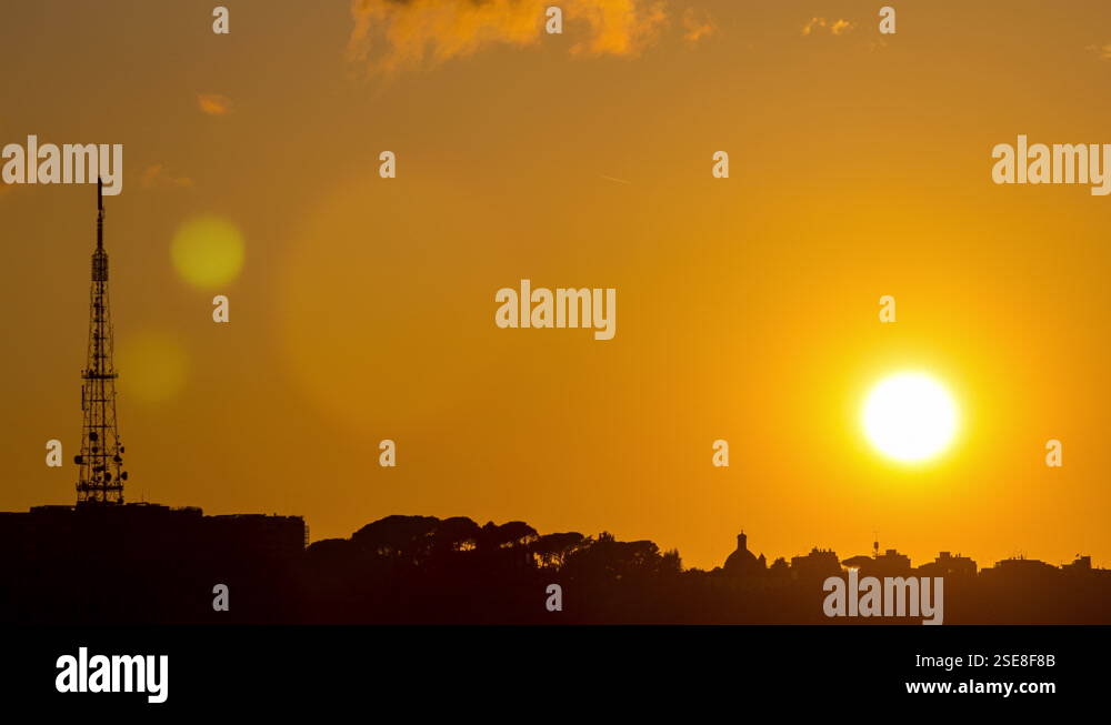Rome at sunset timelapse with the fiery orb of the sun dropping below ...