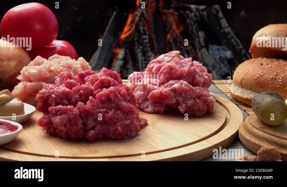 Fresh raw ingredients for homemade burger: chicken, beef and pork ...