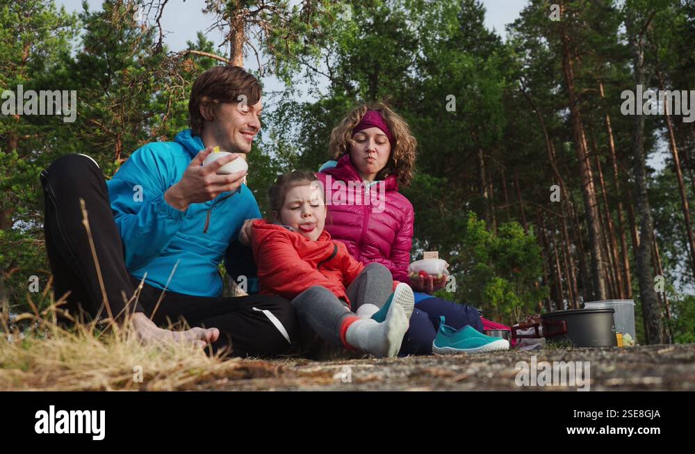 4K Two happy parents kissing on spring camping vacation while naughty ...