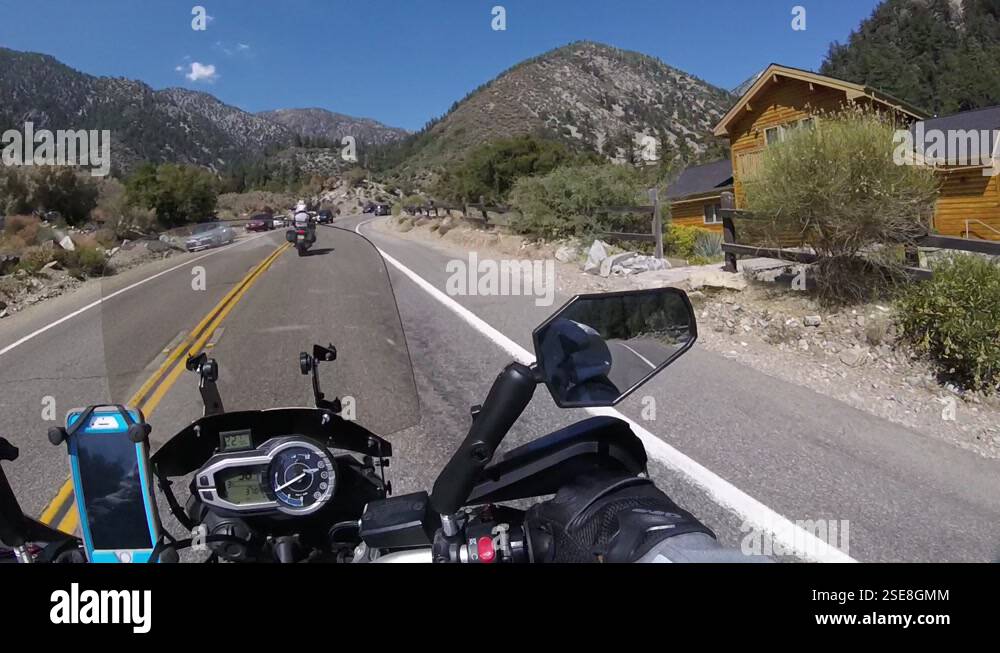 Motorcyclist riding fast on the countryside road to travel with ...