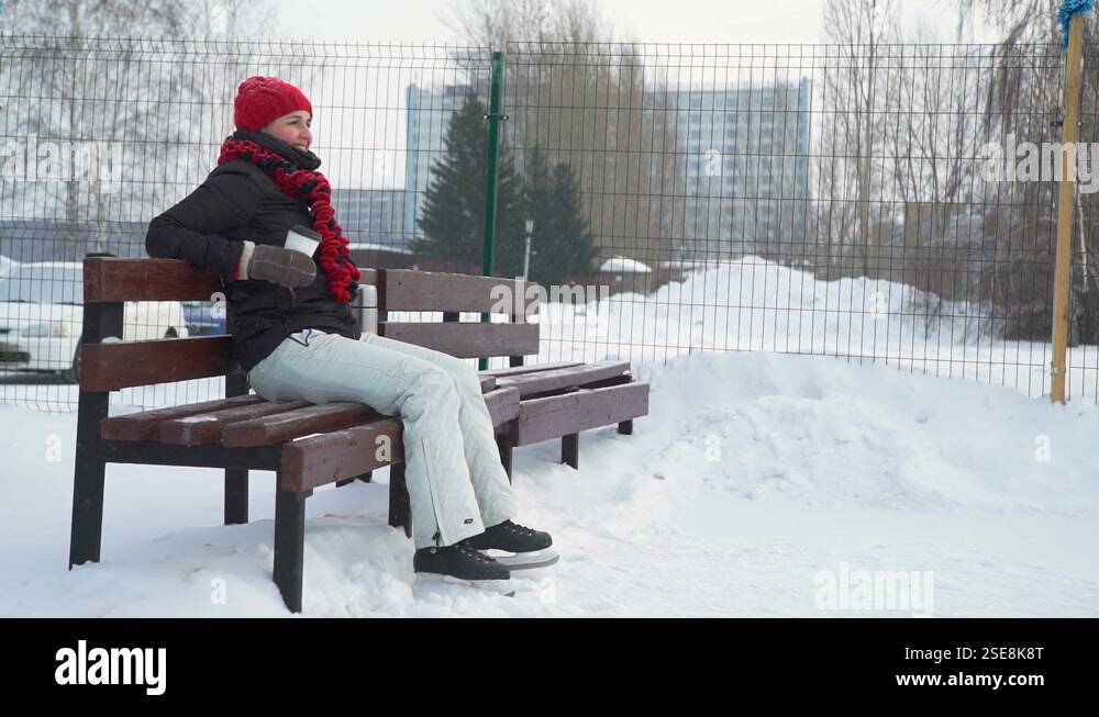 Woman Waving Legs in Ice Skates on the Bench Stock Video Footage - Alamy