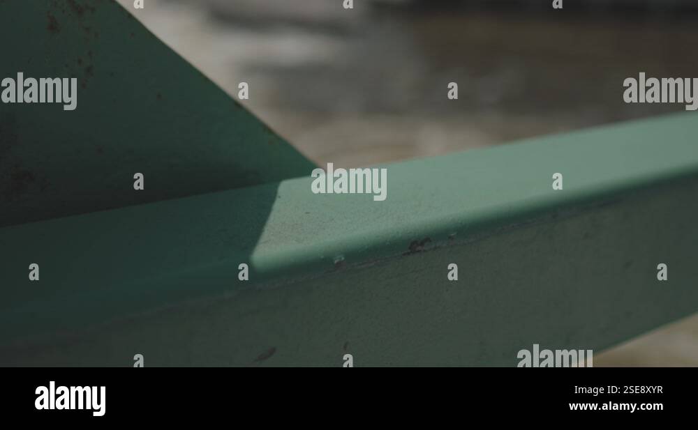 Panning up from behind the steel structures of a bridge over the Ottawa ...