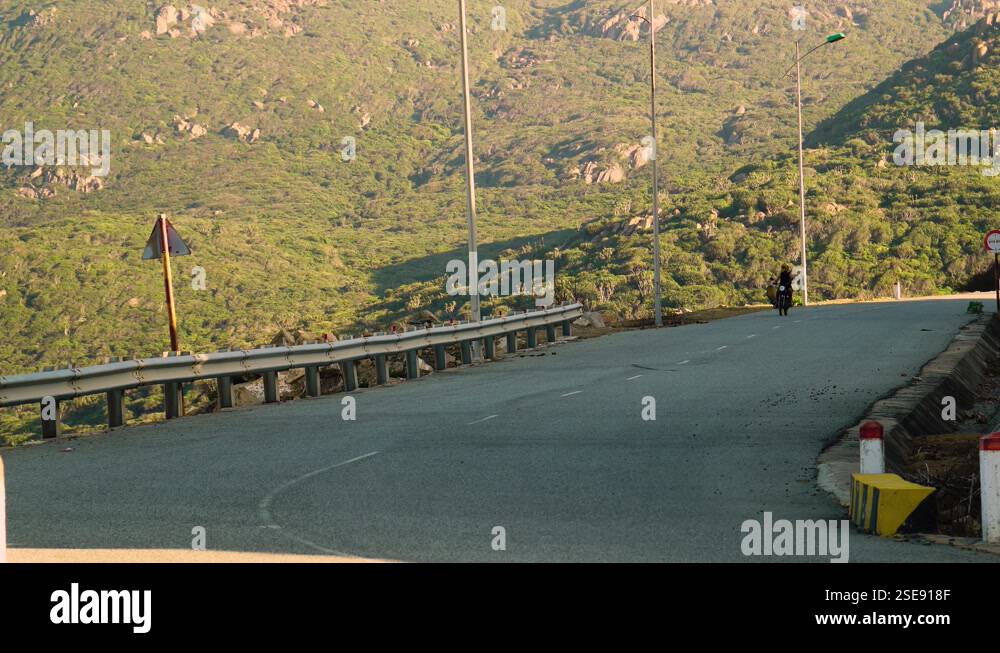 Motorbike With Surfboard Rack Riding Along Winding Road In Vinh Hy ...