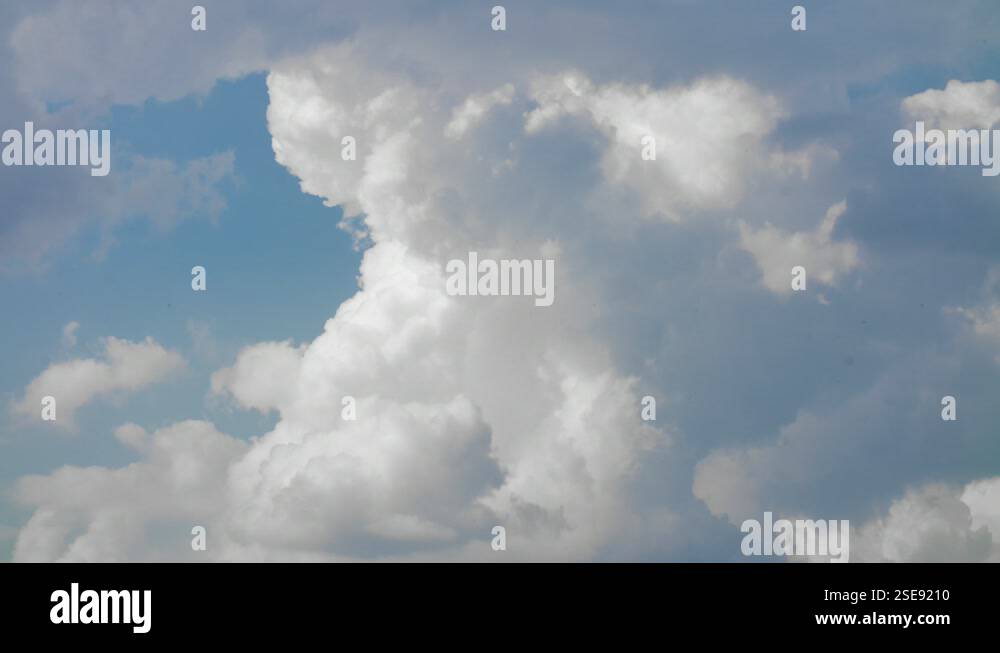 Fluffy white clouds moving fast time lapse. Sunny weather, cloudy ...