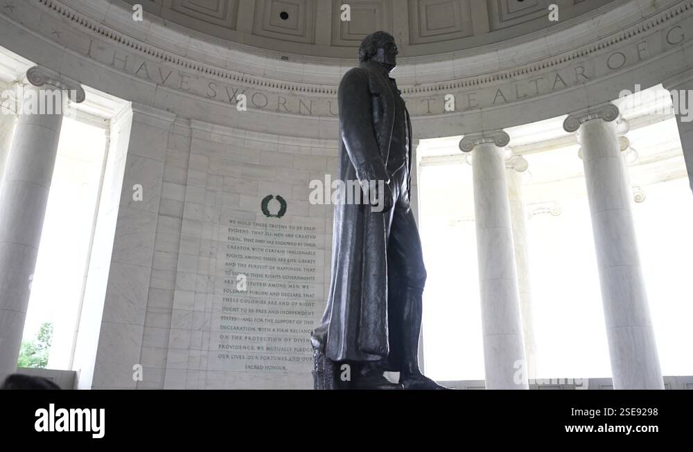 Turning shot of Thomas Jefferson inside the Jefferson Memorial on the ...