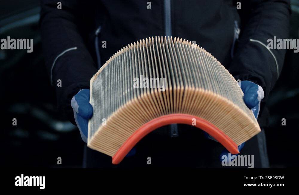 Dirty, old, damaged, aged, car air filter to be replaced in the hands ...
