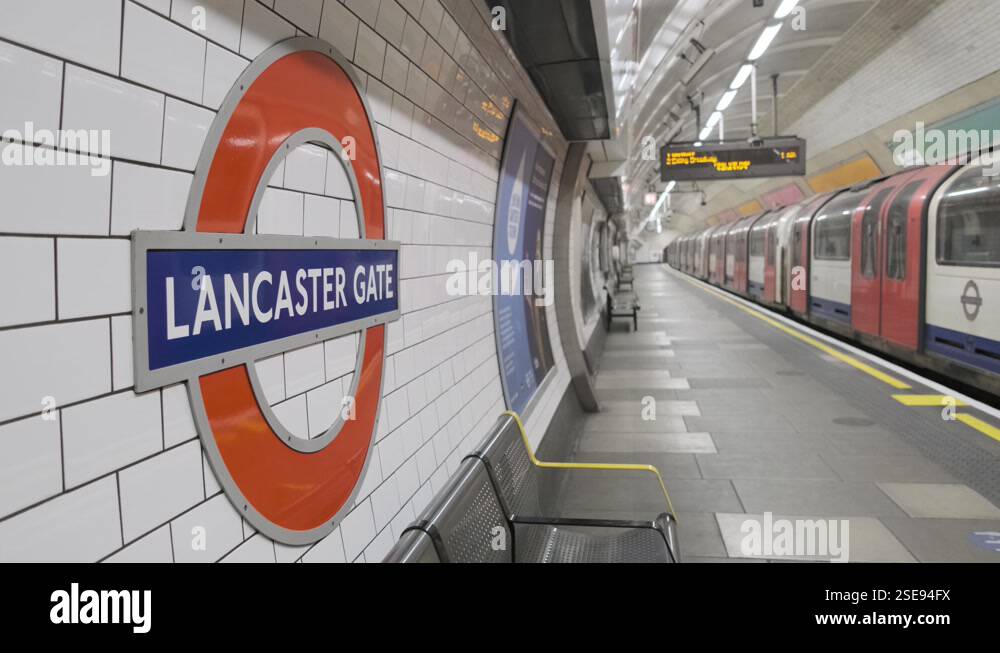 London Central Line tube train leaving an empty Lancaster gate station ...