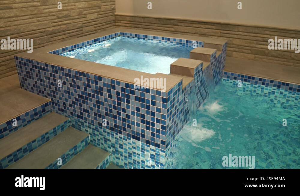 Indoor Jacuzzi With Water Flowing Into Swimming Pool. Dolly Back Stock ...