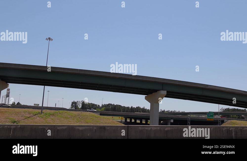Pan of traffic and light posts on multiple bridges Stock Video Footage ...