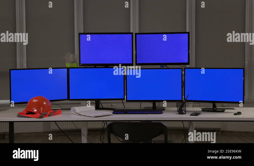 Engineers Workplace. Six Computer Screens. On The Desktop Orange Helmet ...