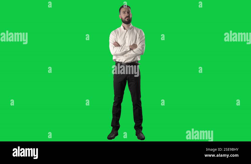 Business man watching with head shake disapproval. Full length on green ...