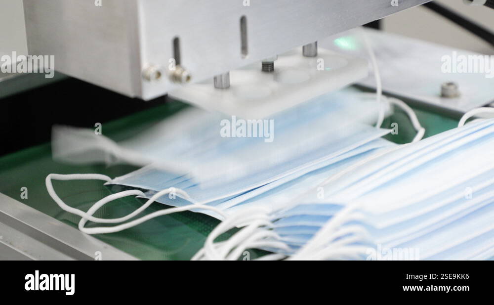 Fully Automated Machine Producing Hospital Surgical Masks - close up ...