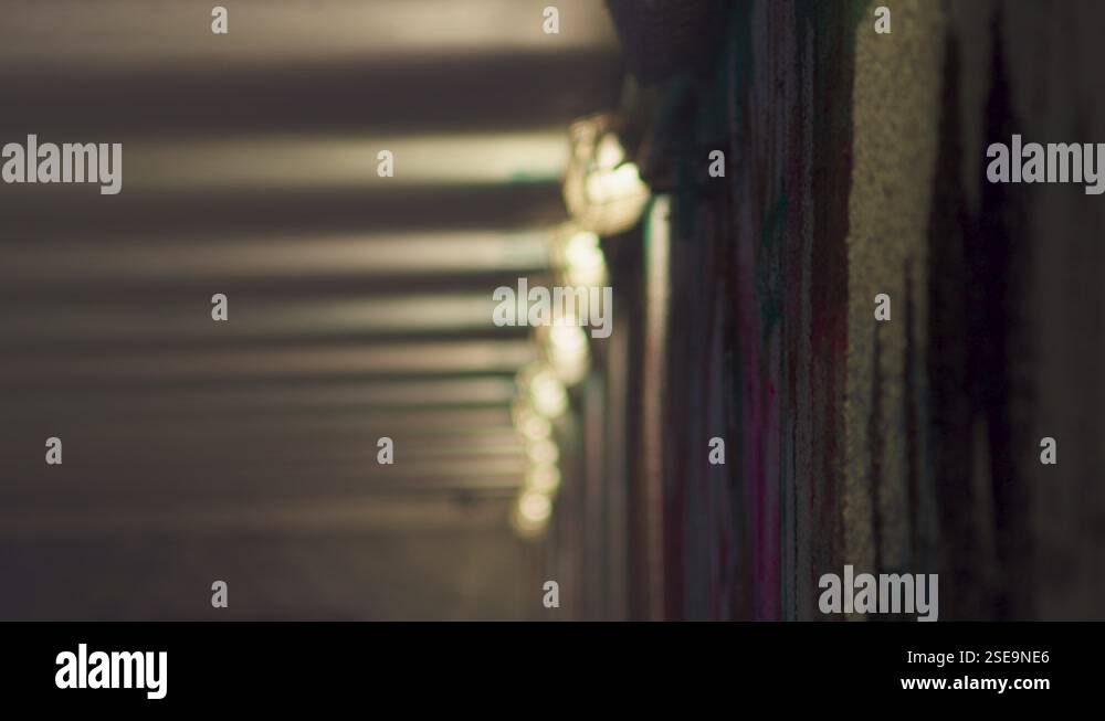 Rack focusing on headlights of urban Pedestrian underpass in Prague ...