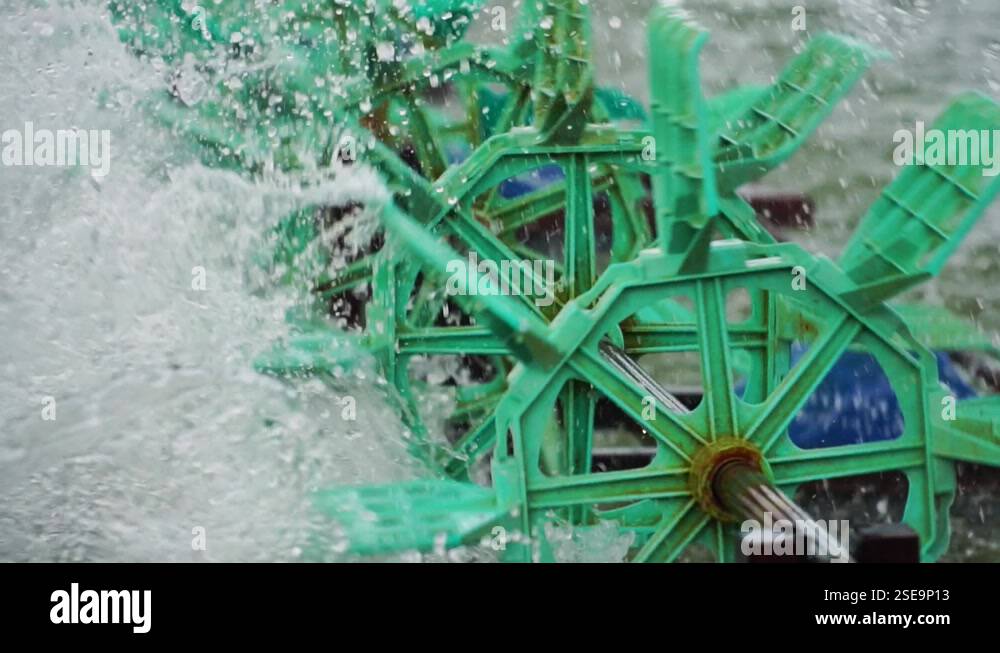 Water turbines spinning and increase oxygen in tub for shrimp farm ...