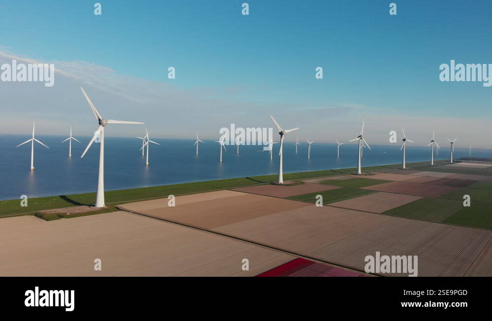 Rotating Offshore Wind Turbines In Netherlands At Summer. wide drone ...