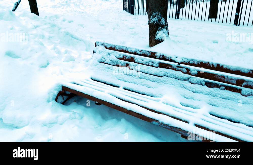 Bench covered with heavy snow in the russian house park Stock Video ...