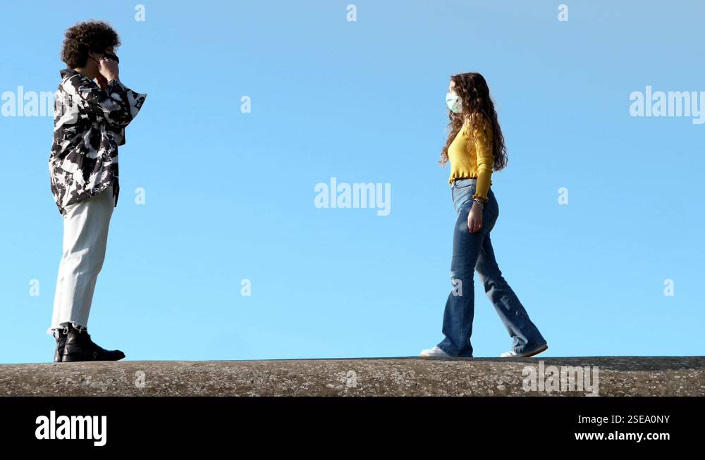 go back to hugging - friends take off the mask and hug each other Stock ...