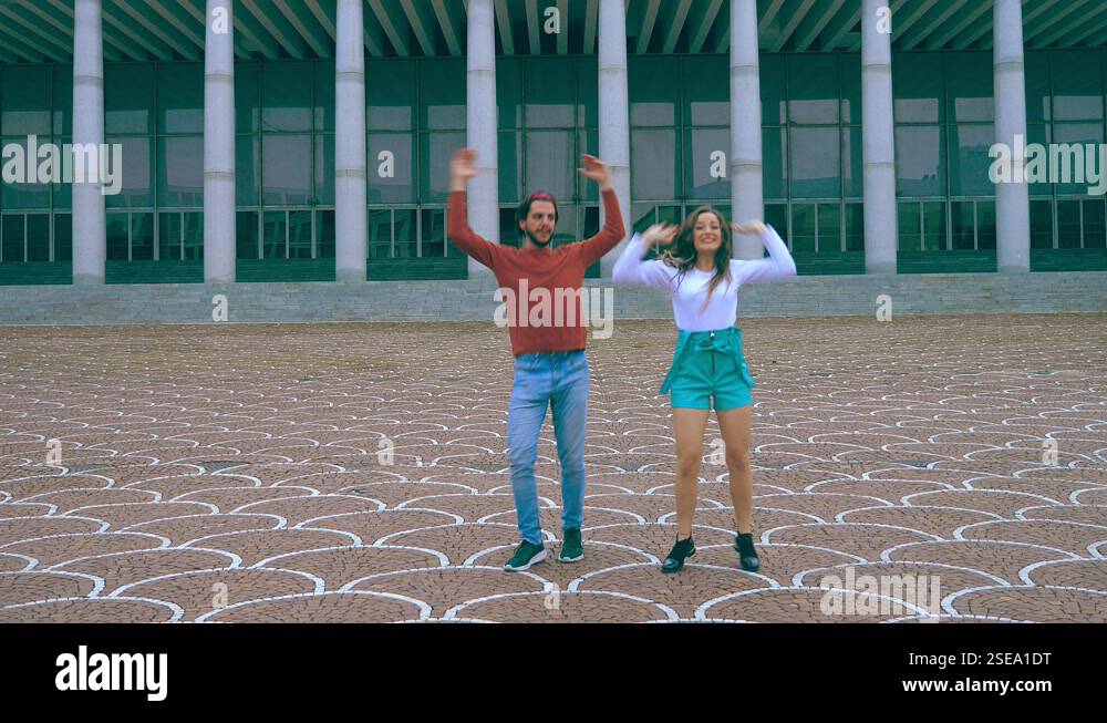 synchronized dance choreography performed by a couple in front of the camera Stock Video Footage ...