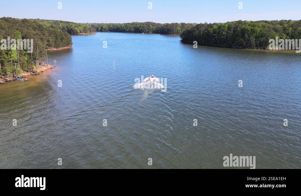 Following a ski boat in an open part of lake channel Stock Video ...