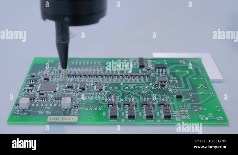 Automatic manipulator with dispenser needle during work with SMT pcb ...